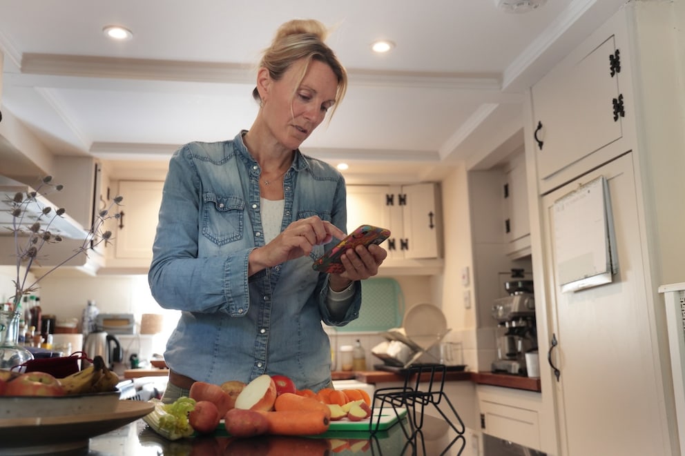 When cooking in the kitchen, you should avoid touching your phone.