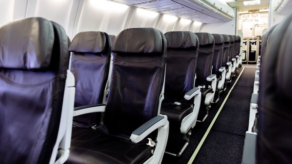 How to Raise the Aisle Armrest on an Airplane - TRAVELBOOK